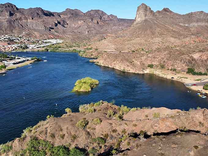 The Colorado River carves through desert mountains like nature's own masterpiece, proving water always finds beauty.