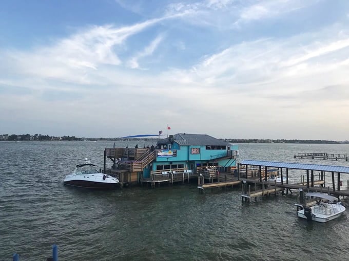 That turquoise and wood exterior isn't just Instagram bait, it's your beacon to Texas's only floating bar experience.