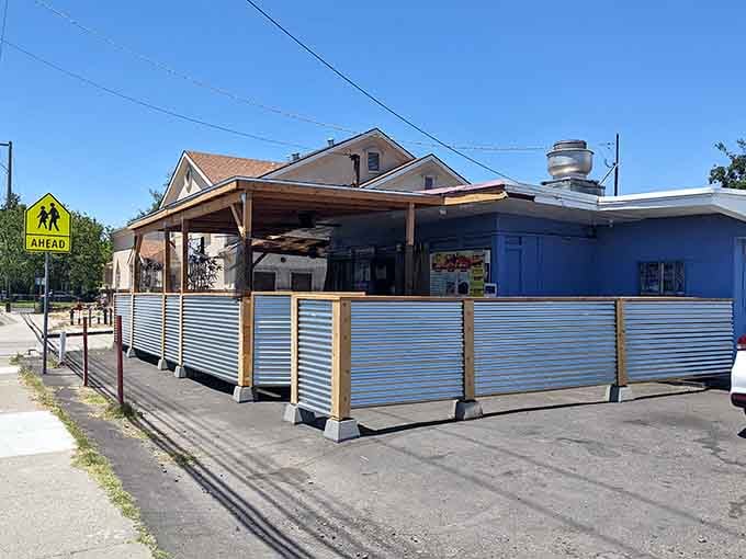 That little blue building holds more flavor than restaurants ten times its size, proving great things come in humble packages.