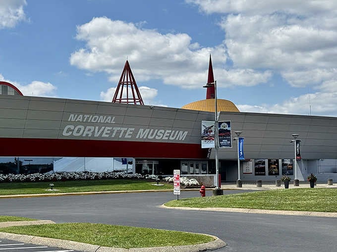 That distinctive red spire reaches skyward like a beacon for anyone who's ever dreamed in horsepower and chrome.