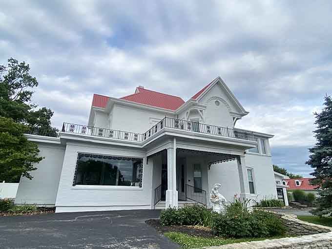 The red roof and white columns create a Southern elegance that makes every visit feel like an occasion.