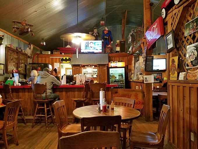 The eclectic interior of Harry & Harry Too features vintage collectibles, corrugated metal walls, and cozy wooden tables for a memorable meal.