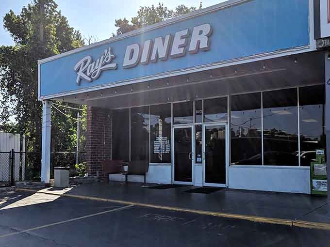That bright blue sign isn't just directing you to breakfast, it's pointing toward pure morning happiness.