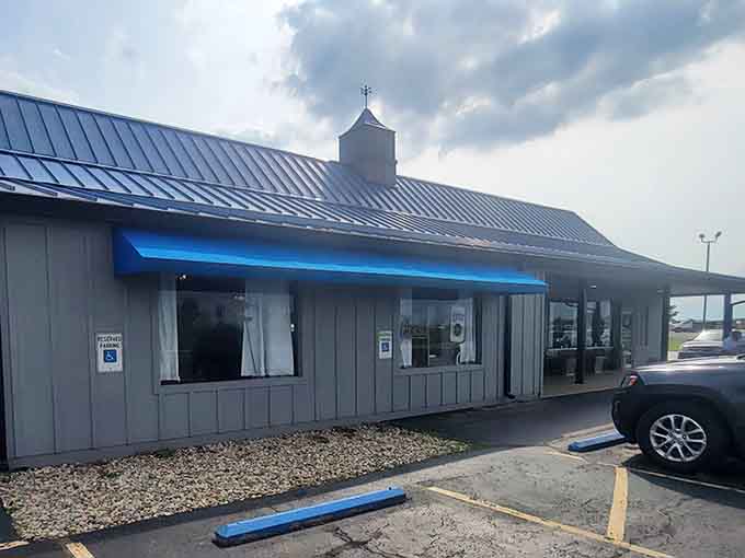 That blue awning beckons like a beacon of buttery goodness, promising homemade comfort in every slice of pie.