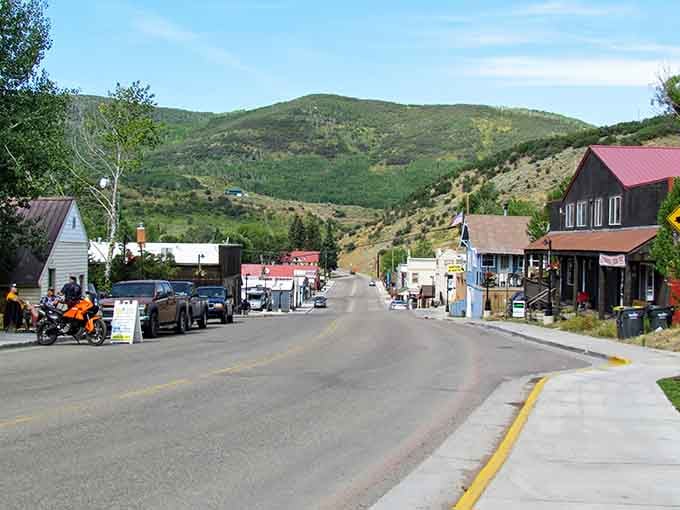 Main Street Oak Creek stretches toward mountains like a postcard that decided to become real life instead.