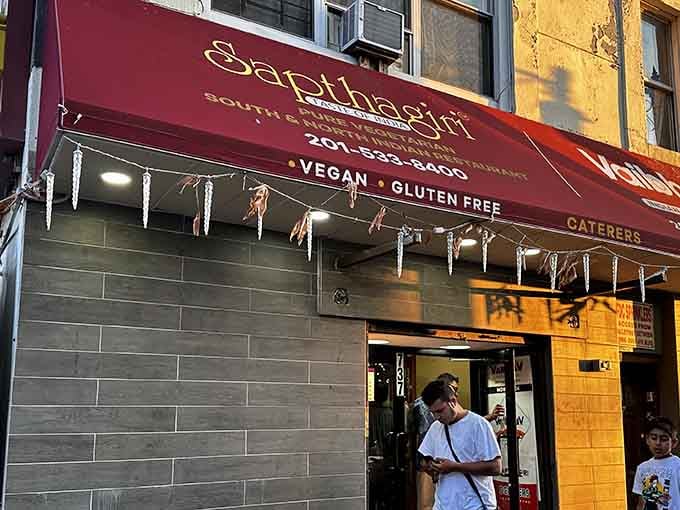 That burgundy awning beckons like a flavor-filled lighthouse guiding hungry souls to vegetarian paradise in Jersey City.