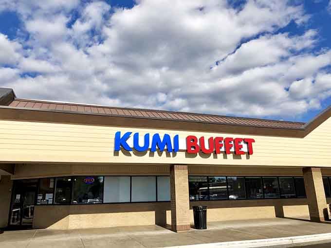 That bold blue and red signage isn't just announcing a restaurant – it's declaring a full-scale flavor invasion.
