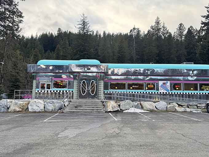 That chrome gleam against towering pines proves American diner culture thrives anywhere, even surrounded by Bavarian architecture and mountain air.