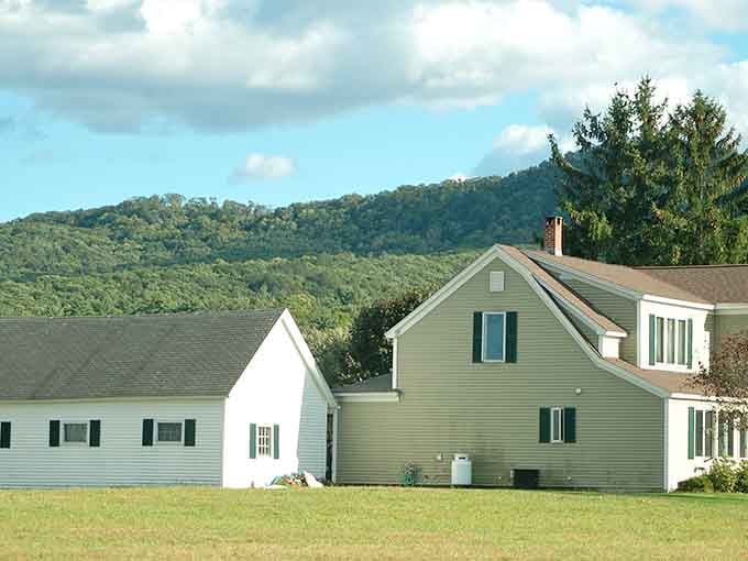 Those rolling hills behind classic New England homes create views that make your morning coffee taste even better somehow.