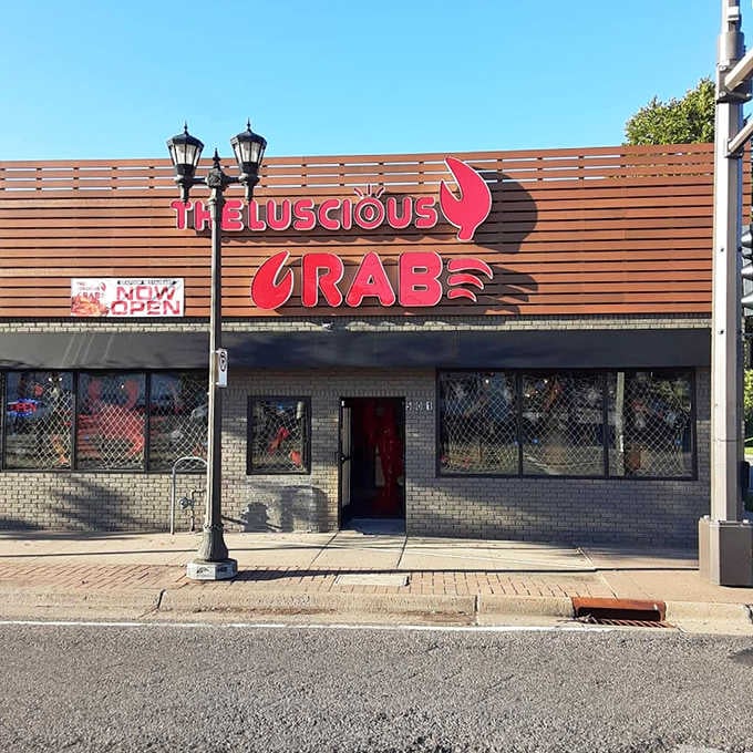 That bold red crab logo isn't just decoration, it's a promise of the buttery chaos awaiting inside.