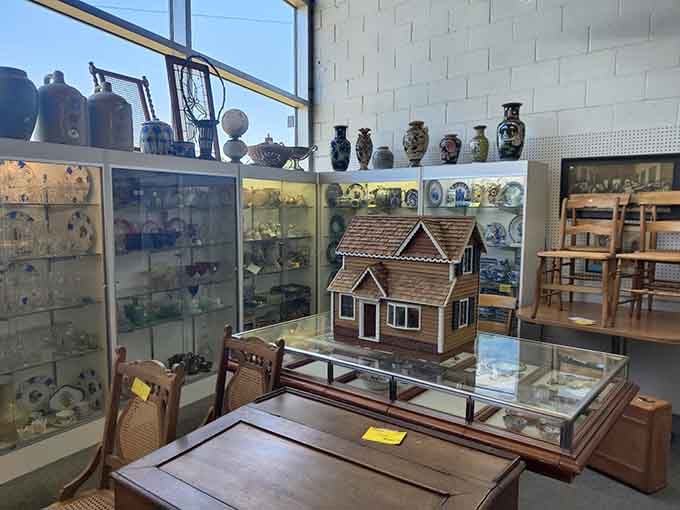 Explore a charming collection of vintage furniture and intricate dollhouses that capture the timeless beauty of local antique treasures.