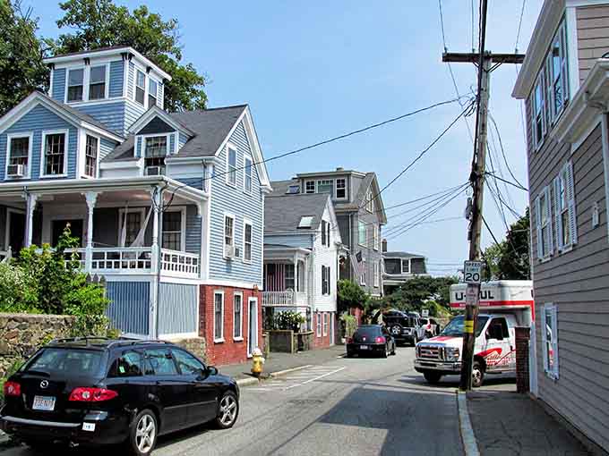 Colonial homes lined up like a paint chip display, proving New England has always understood the assignment.