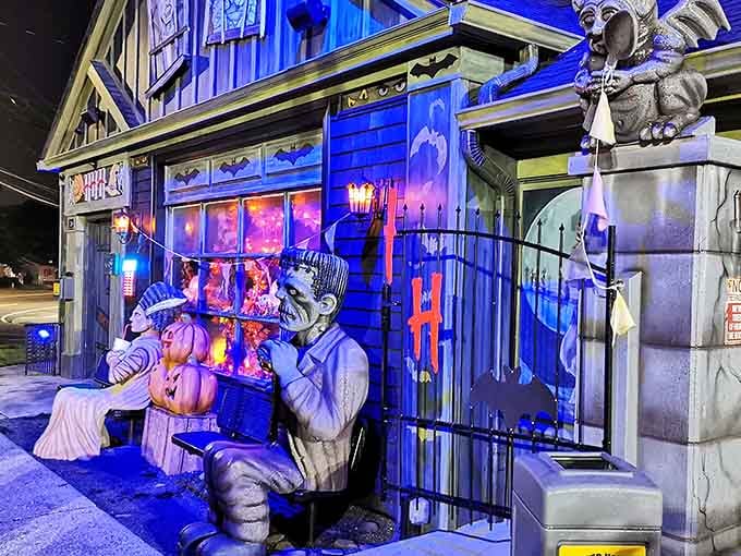 Life-sized monsters guard the entrance at night, their dramatic poses illuminated by purple lights that transform ordinary Farmingdale into Transylvania.