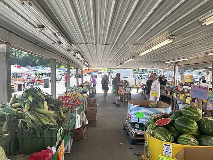The covered produce pavilion bustles with Friday shoppers hunting for corn and melons under those classic metal awnings.