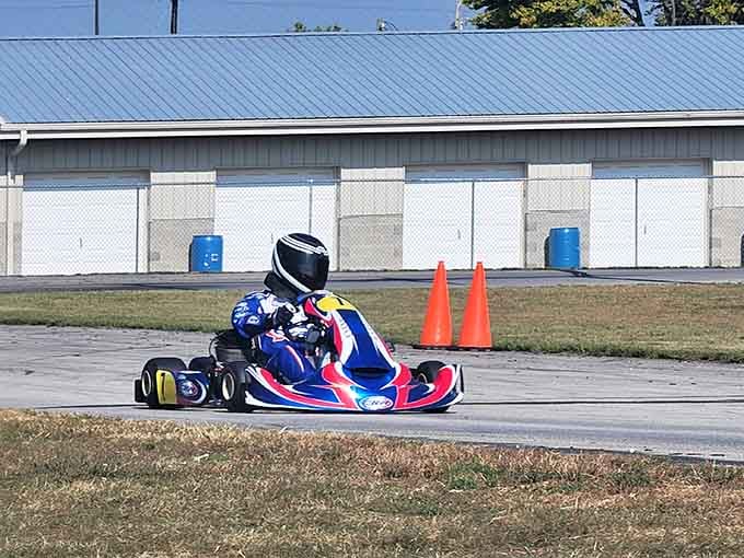 When a kid in a racing suit looks more professional than you do at your actual job, you know this place means business.