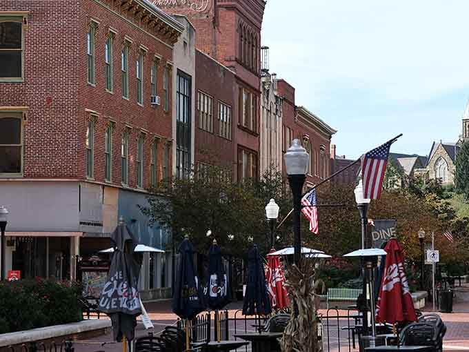 Victorian storefronts line brick streets where American flags wave proudly, creating a downtown that feels refreshingly timeless and authentic.