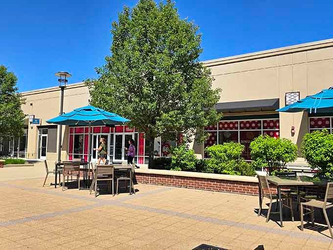 The outdoor plaza beckons with promises of retail therapy and questionable financial decisions under sunny skies.