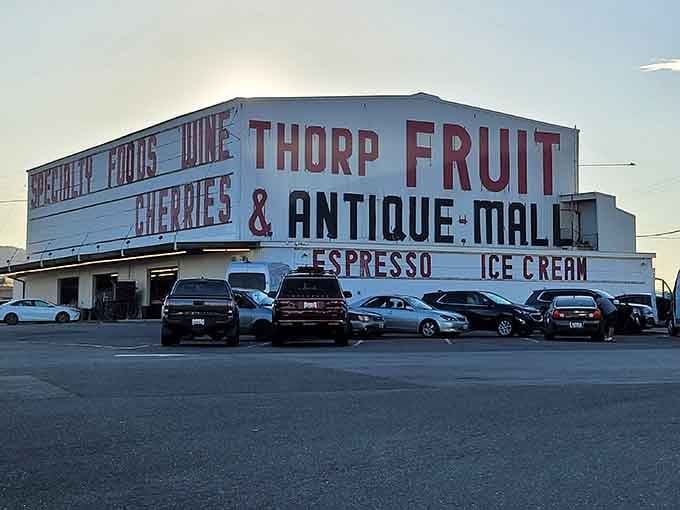The building's bold signage announces fresh cherries and apricots like a delicious billboard you can actually shop inside.