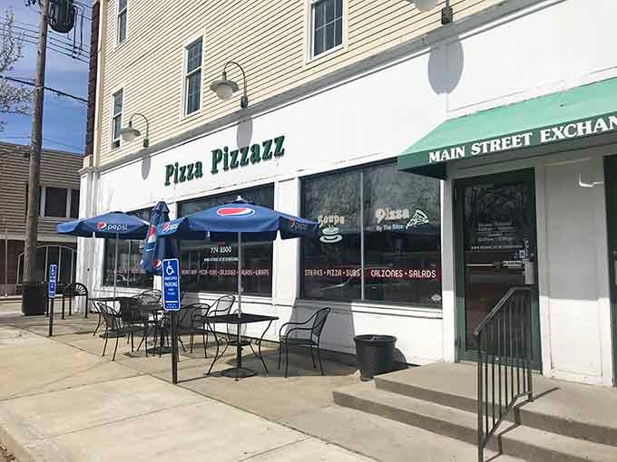 Those outdoor tables under blue umbrellas are calling your name for a perfect pizza lunch in the sunshine.