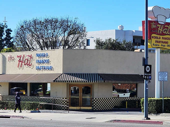 That iconic chef's hat sign isn't just advertising, it's a promise of pastrami paradise waiting inside.