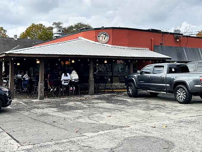 The bustling outdoor seating area fills with folks who know exactly what they're here for: burgers that defy reasonable expectations.