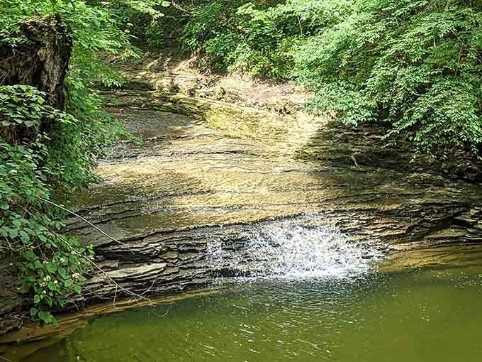 Nature's architecture at its finest, where ancient limestone meets cascading water in perfect harmony.