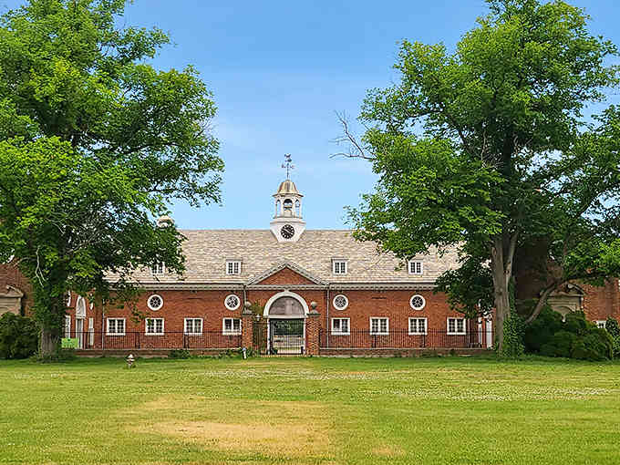 That tree-lined horizon isn't just a driveway&mdash;it's your portal to a world where millionaires once played polo.