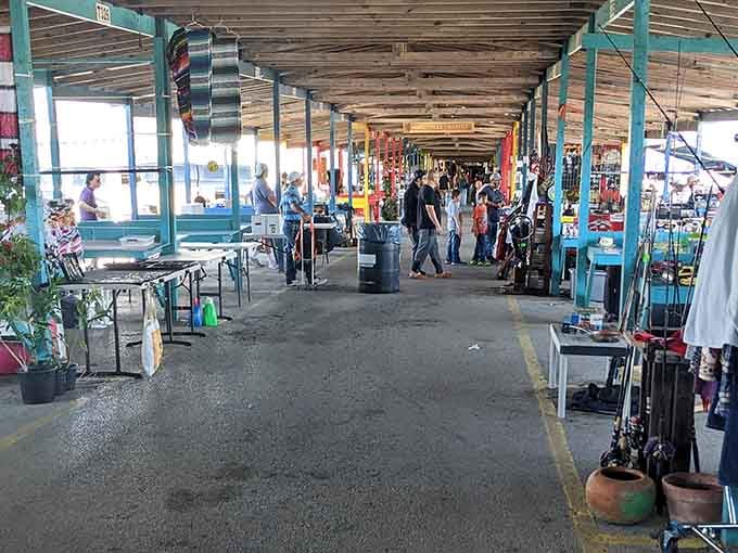 The main aisles stretch endlessly under those distinctive turquoise beams, promising adventure around every corner.