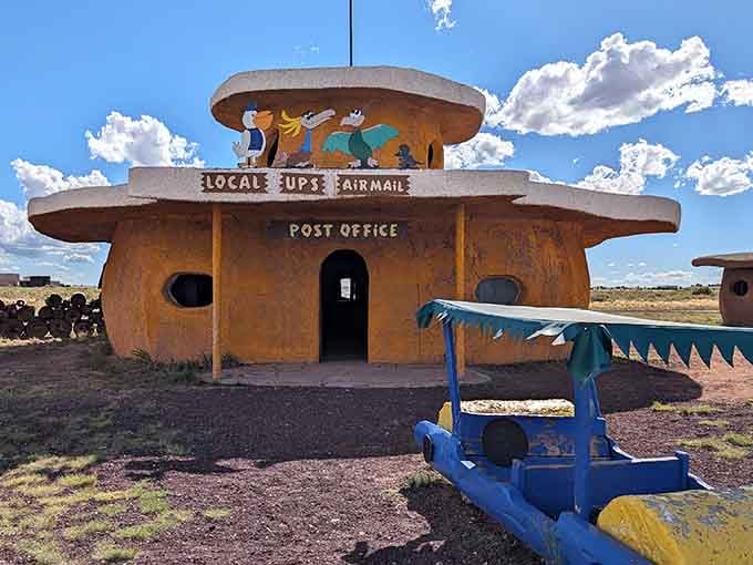 The Bedrock Post Office stands ready to handle all your Stone Age mail, complete with Fred and Barney keeping watch from above.