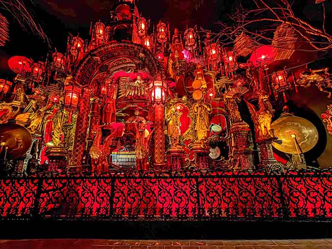 This glowing red wonderland of musical instruments looks like a dragon's treasure hoard had a baby with Broadway.
