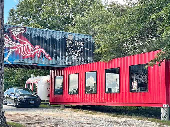 Shipping containers transformed into art galleries with eccentric murals watching over your windshield tour through creative chaos.