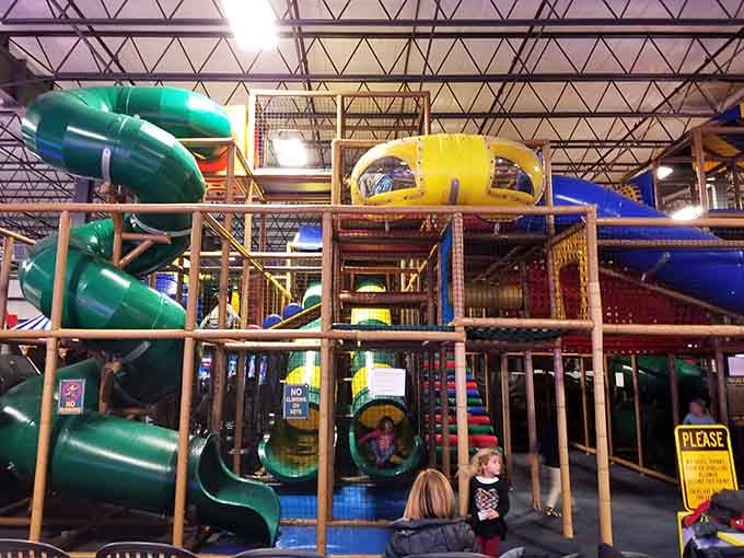 That towering play structure isn't just for kids, it's basically an architectural marvel designed for maximum fun.