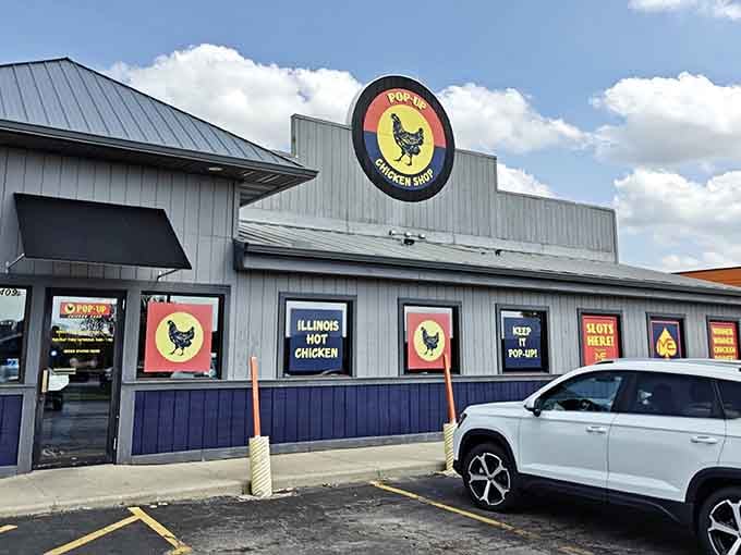 That cheerful yellow chicken logo against blue skies promises exactly what your taste buds have been craving all week.