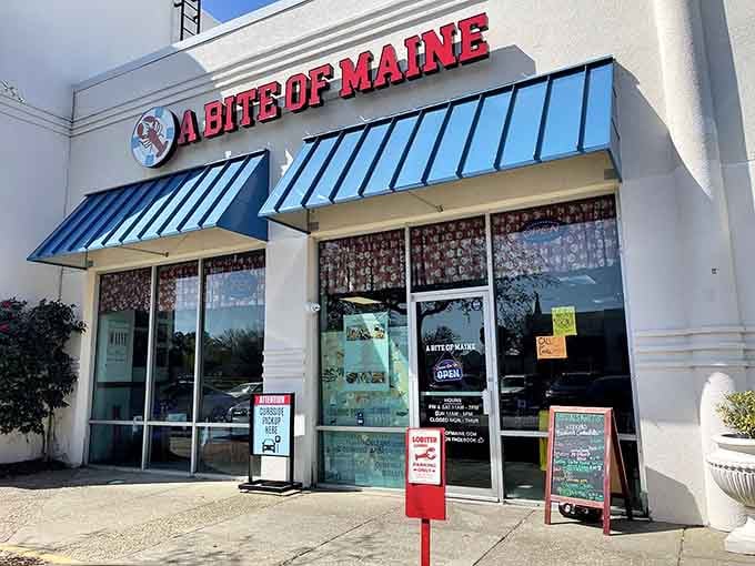 The blue awnings and bold red lettering announce your arrival at seafood paradise, no lighthouse required for this coastal destination.