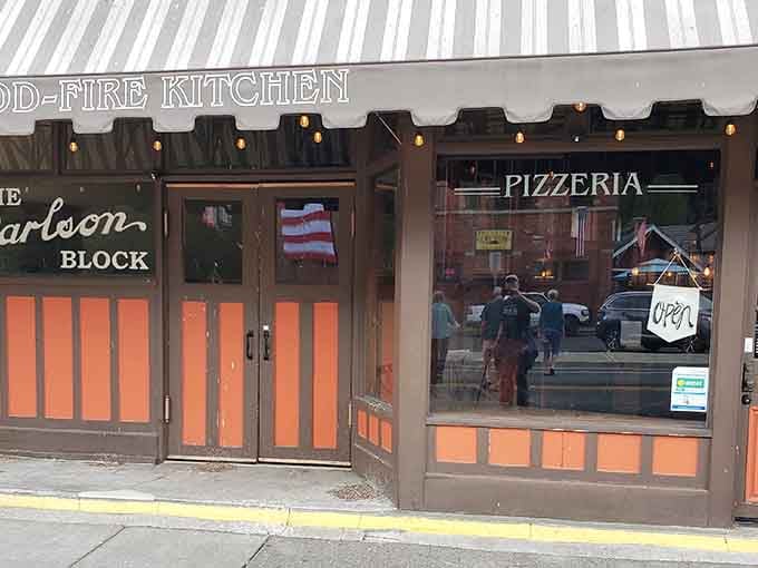 The warm glow through those windows isn't just lighting, it's a beacon calling pizza lovers home.