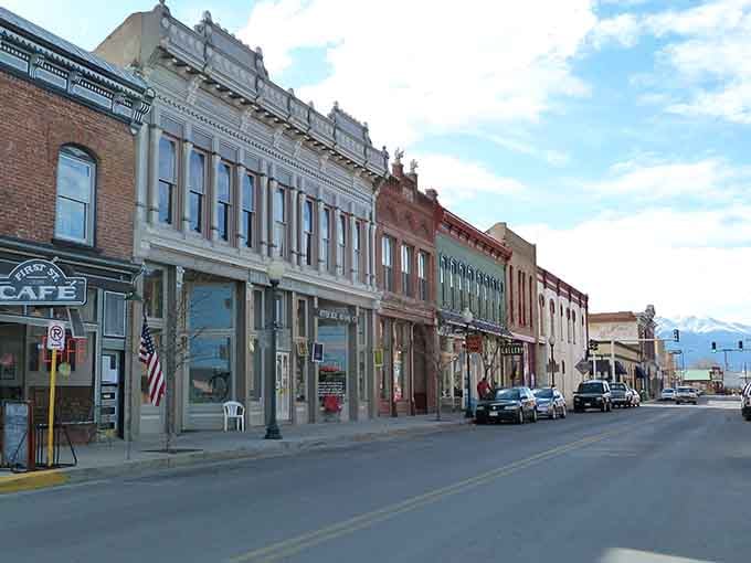 Historic storefronts line the streets where Victorian architecture meets modern mountain town charm and endless blue skies.
