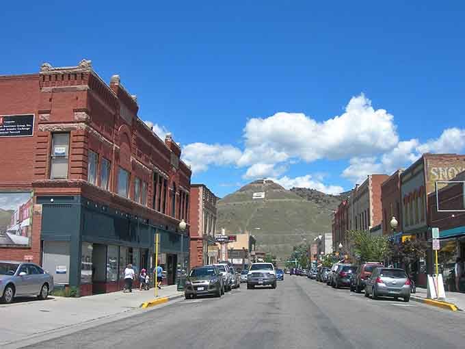 Historic storefronts line the streets where Victorian architecture meets modern mountain town charm and endless blue skies.