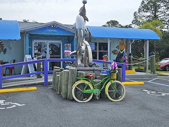 That bright blue awning and whimsical dolphin sculpture announce you've arrived at something special on Florida's Gulf Coast.