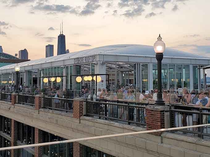 That golden hour glow hitting the glass pavilion makes Navy Pier's secret rooftop look like a lakeside dream.
