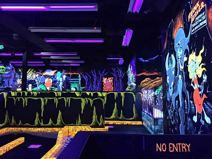 When blacklight meets mini golf, you get a neon wonderland that looks like Willy Wonka designed a haunted house.