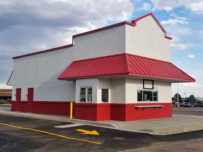 The classic red and white exterior of Short Stop Burgers is a welcoming sight for hungry burger lovers in Colorado Springs.