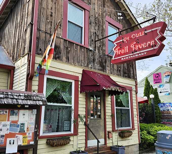 That weathered wood and glowing neon sign aren't trying to look old, they've earned every gorgeous year of patina.