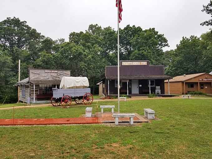 Old Glory waves over the village square where covered wagons and weathered storefronts tell stories without saying a word.