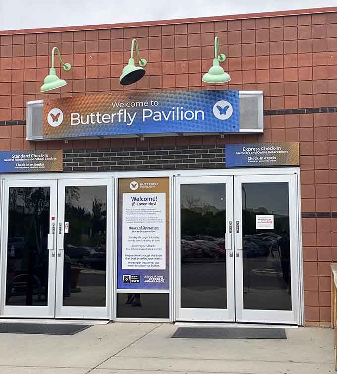 The unassuming entrance to Westminster's tropical paradise, where butterflies outnumber the parking spots and nobody's complaining about it.