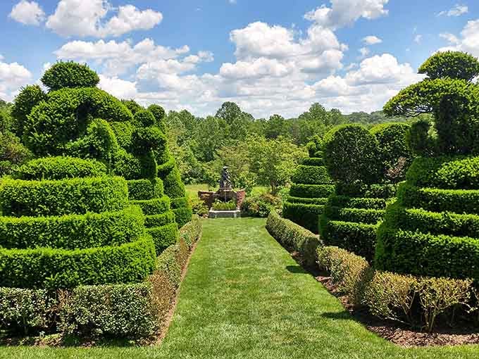 The perfectly manicured pathways and sculpted hedges at Ladew Topiary Gardens showcase the incredible artistry that awaits your visit to Monkton.