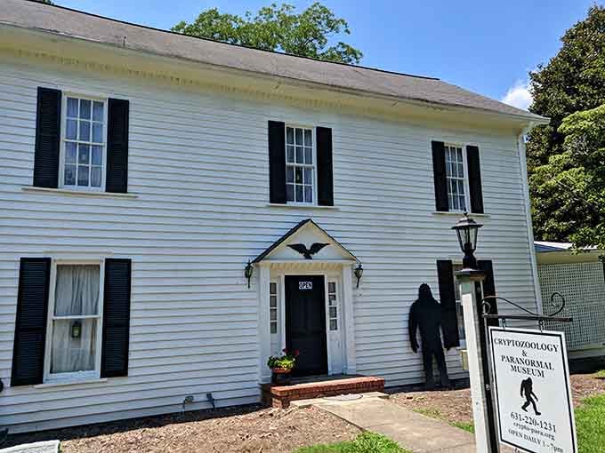 That charming white house with black shutters hides something wonderfully weird: Bigfoot silhouettes guard mysteries within.