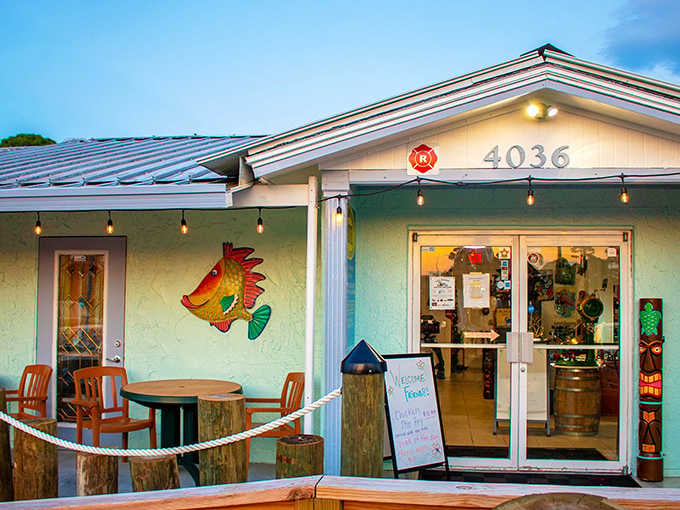 That colorful fish mural and tiki torch combo says "Florida waterfront restaurant" louder than a parrot with a megaphone.