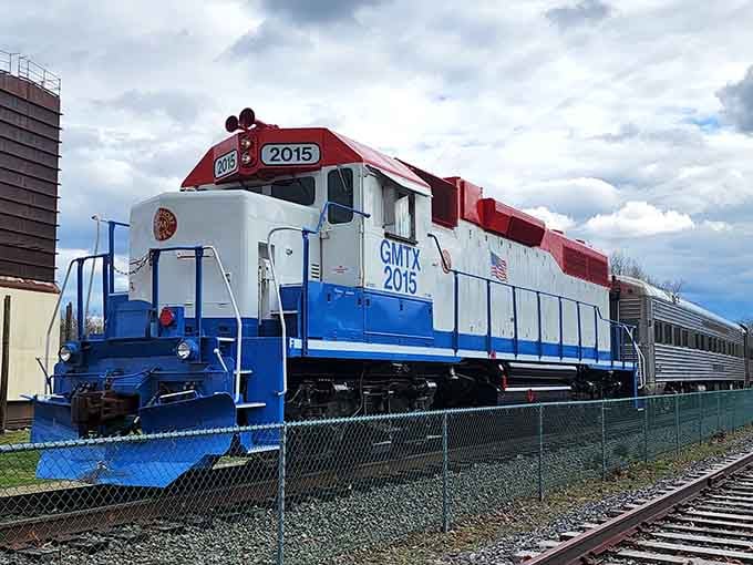 That striking blue and red paint scheme makes this locomotive look like it's ready for its closeup.