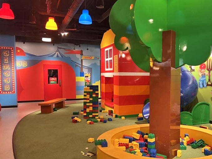 Bright structures tower overhead, proving that childhood imagination has no height restrictions or building codes.