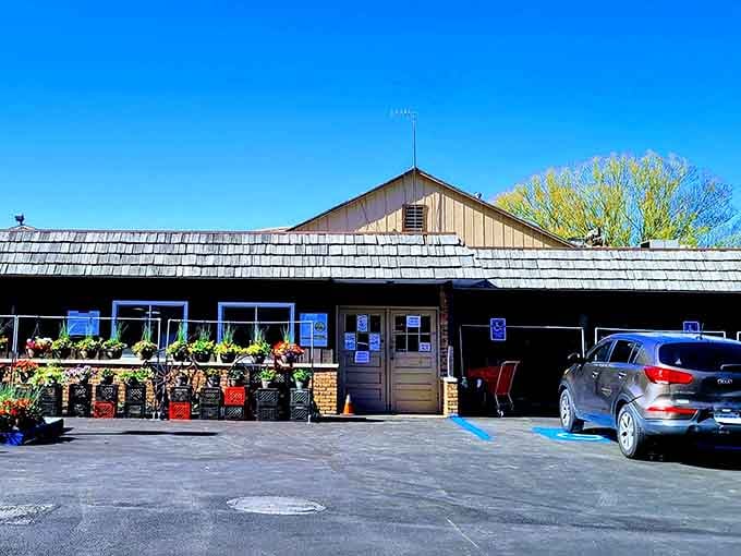The farm market welcomes you with flowers and that unmistakable promise of fresh-picked goodness waiting inside.